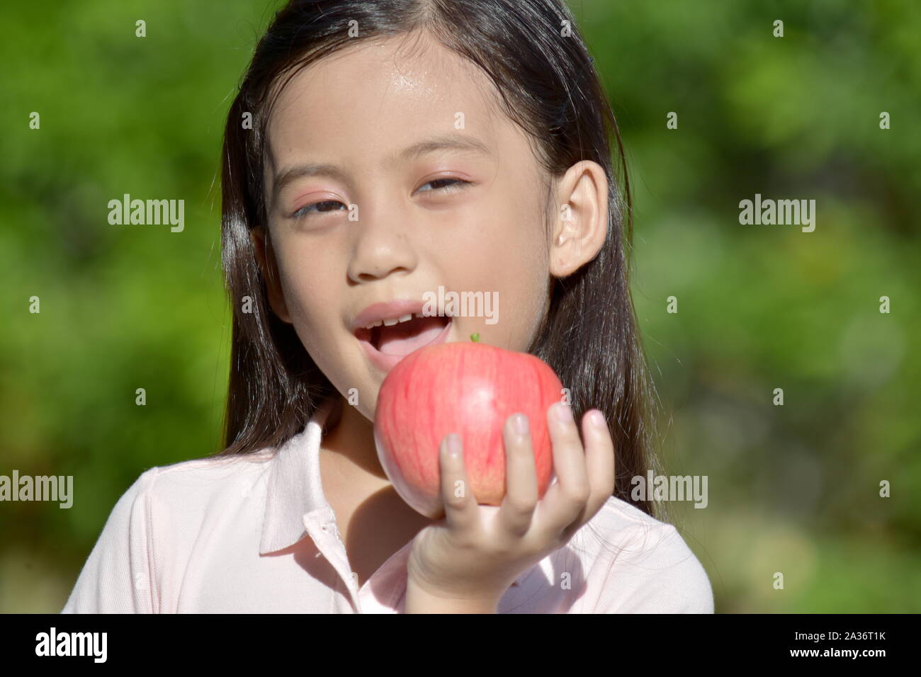 A Beautiful Girl Eating With Food Stock Photo - Alamy