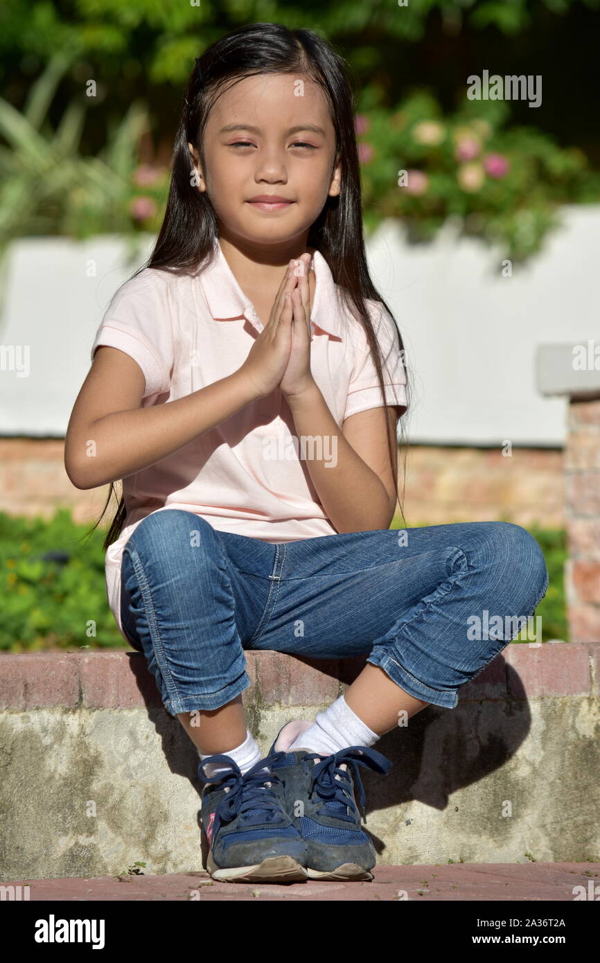 A Young Minority Youth In Prayer Stock Photo - Alamy