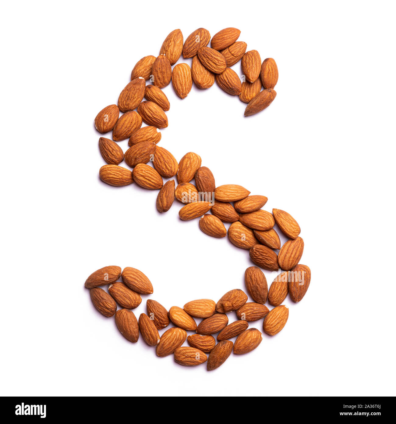 The letter "S" of the English alphabet from a peeled almond on a white ...