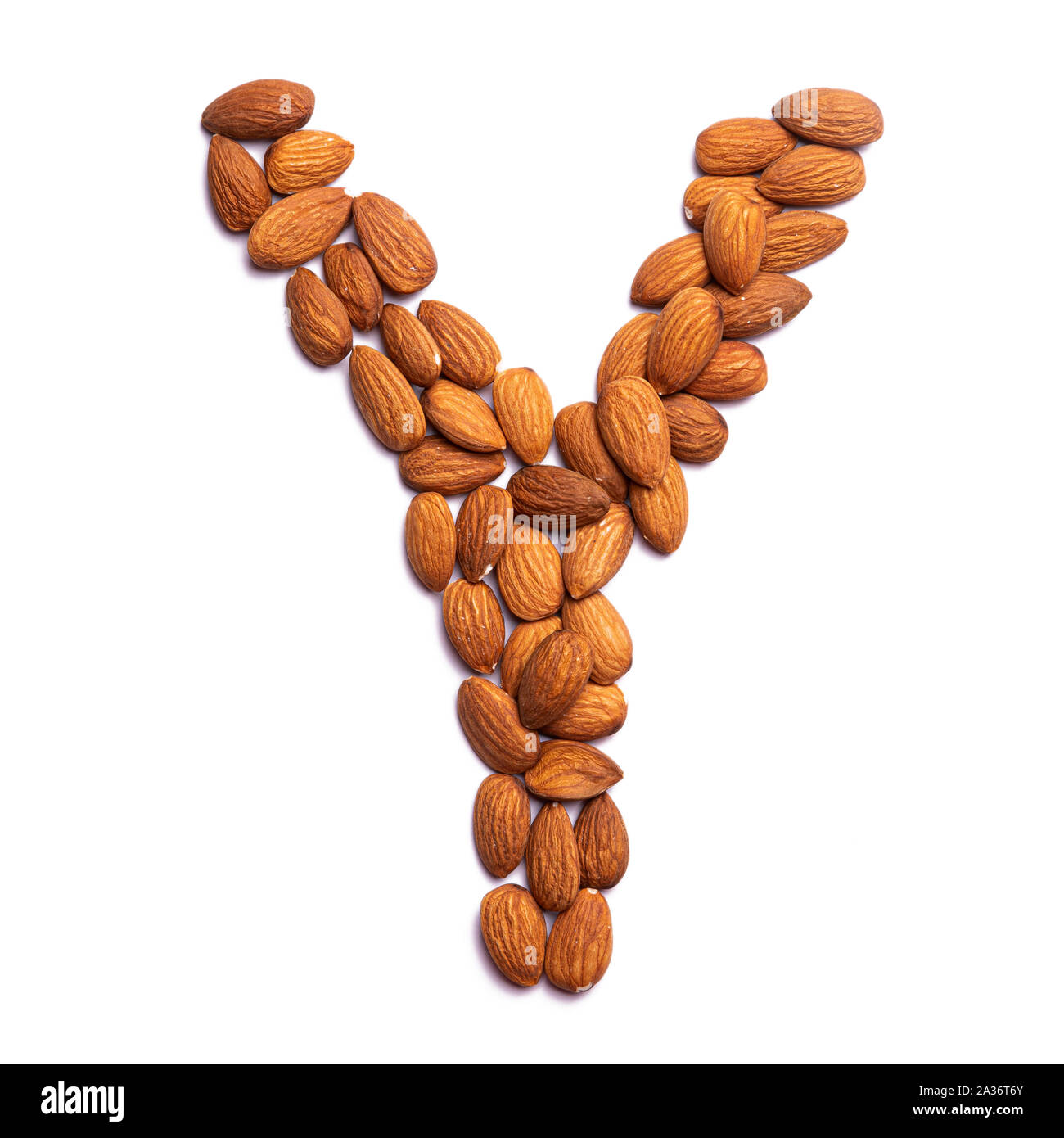 The letter "Y" of the English alphabet from a peeled almond on a white ...