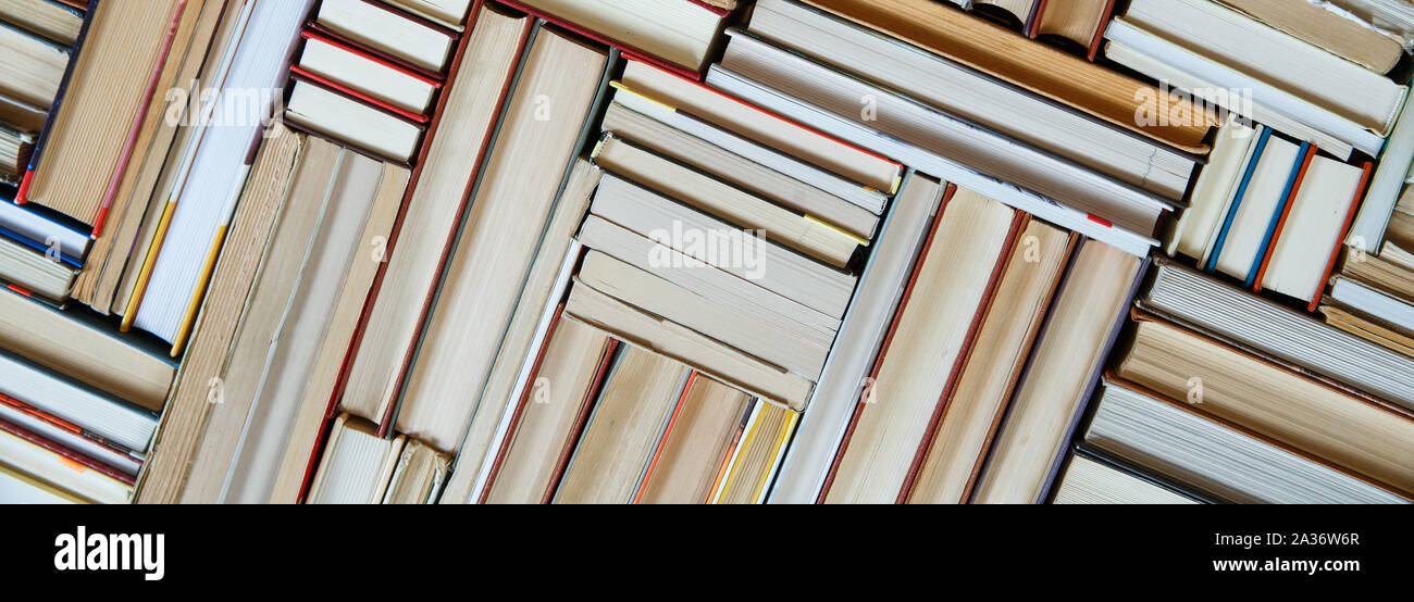 Books stack texture and background Stock Photo - Alamy