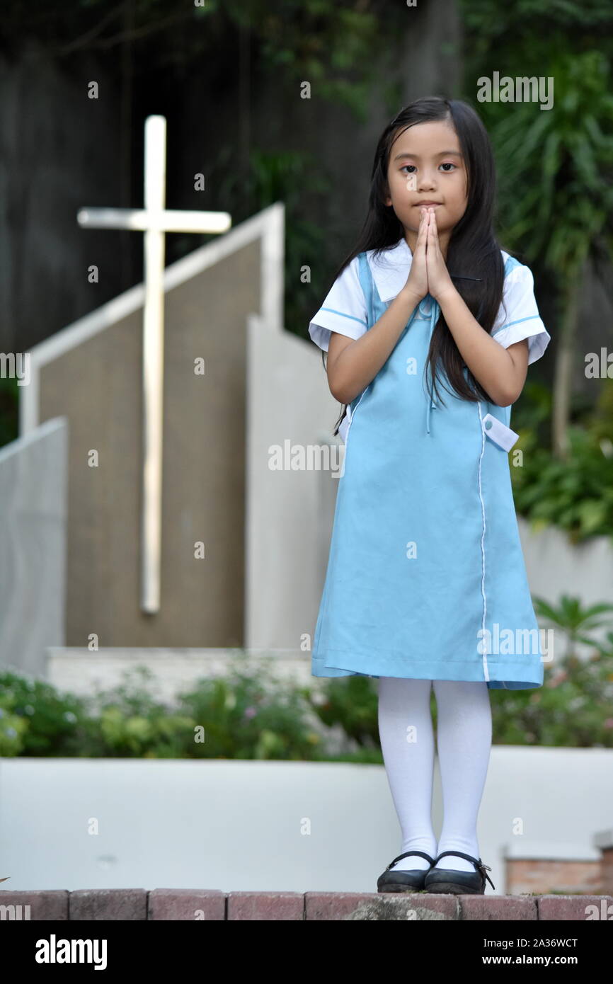 Child praying cross hi-res stock photography and images - Alamy