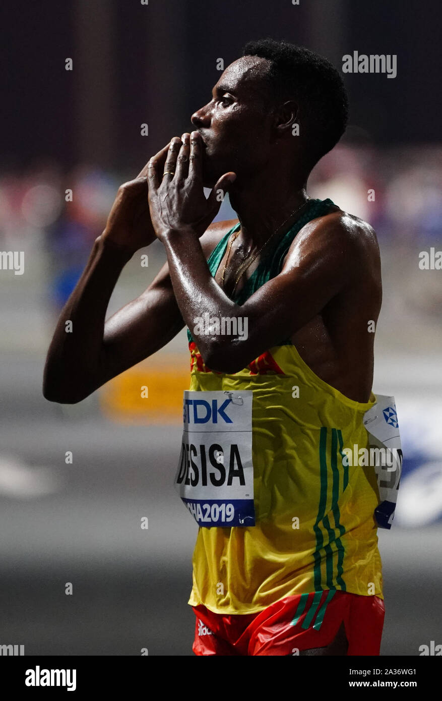 Doha, Qatar. 5th Oct, 2019. Lelisa Desisa of Ethiopia celebrates after ...