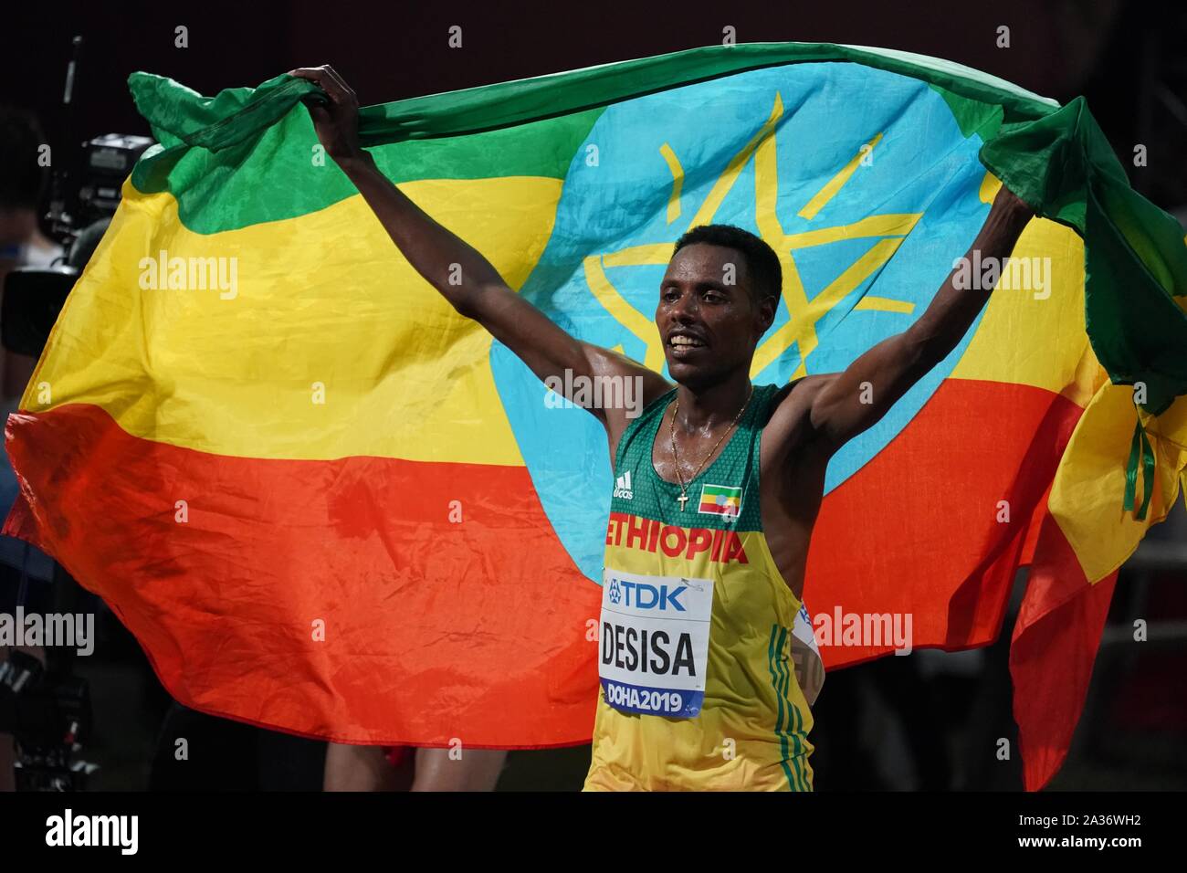 Doha, Qatar. 5th Oct, 2019. Lelisa Desisa of Ethiopia celebrates after ...