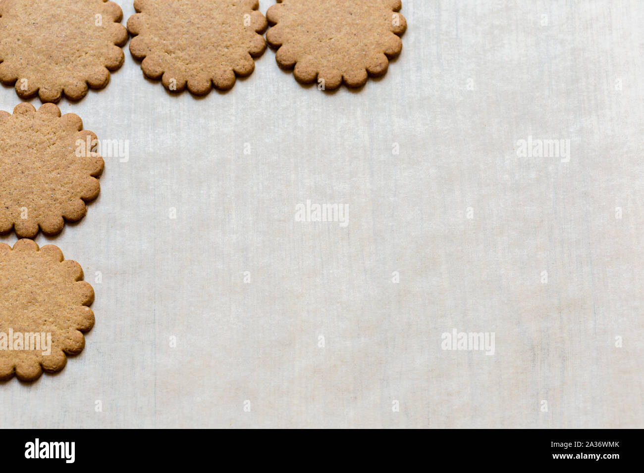 Yummy Ginger cookies on baking paper, traditional Christmas treat ...