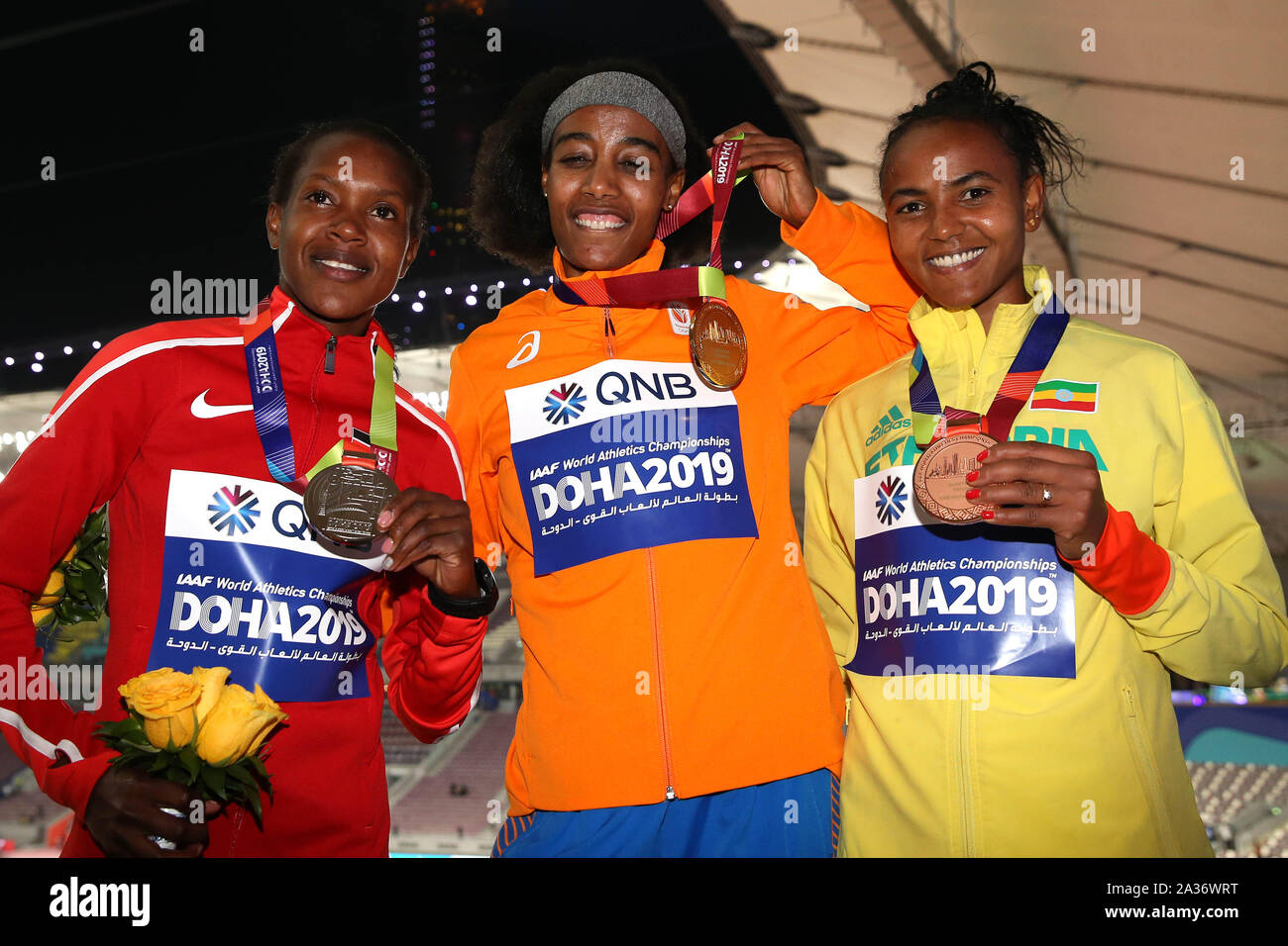 Doha, Qatar. 5th Oct, 2019. Gold medalist Sifan Hassan (C) of the Netherlands, silver medalist ...