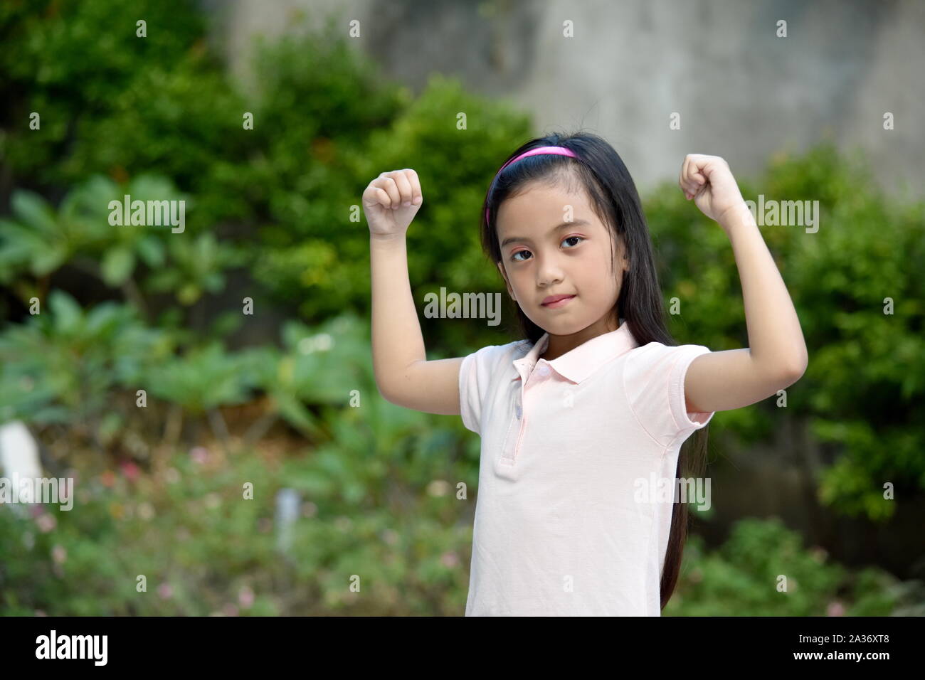 Girl flex muscles hi-res stock photography and images - Alamy