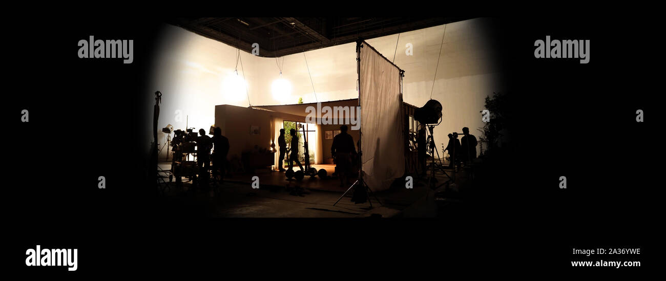 Silhoutte images of video production and lighting set for filming which ...