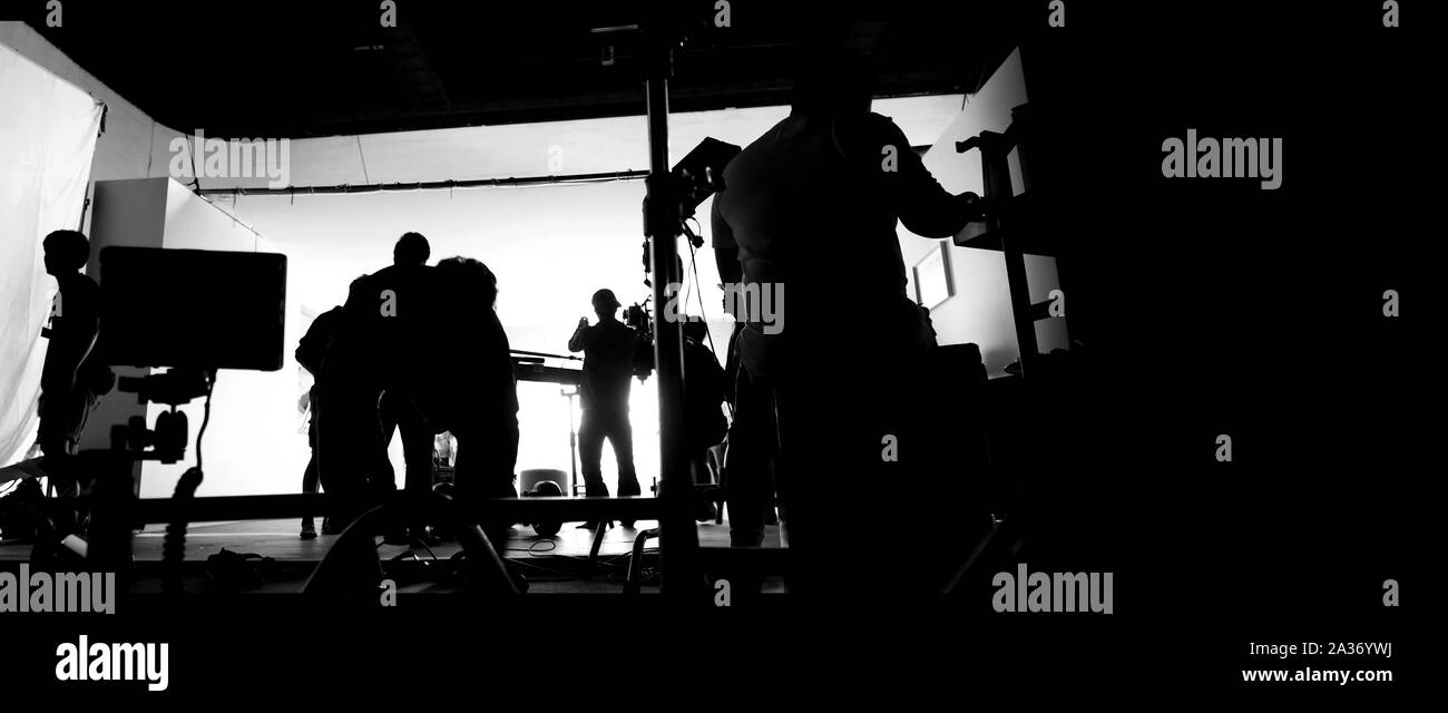 Silhoutte images of video production and lighting set for filming which ...
