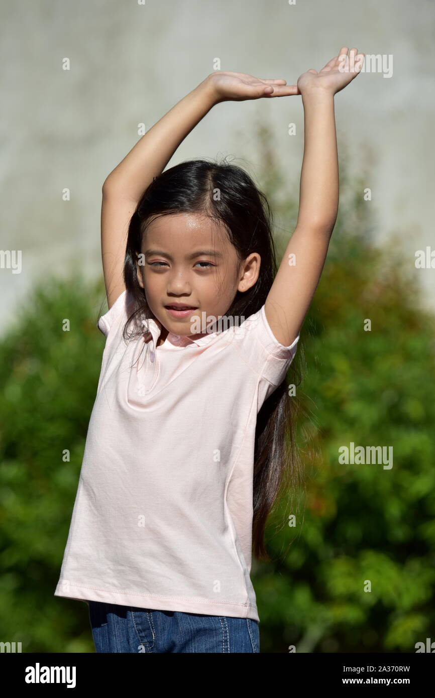 A Stretching Petite Filipina Female Stock Photo - Alamy