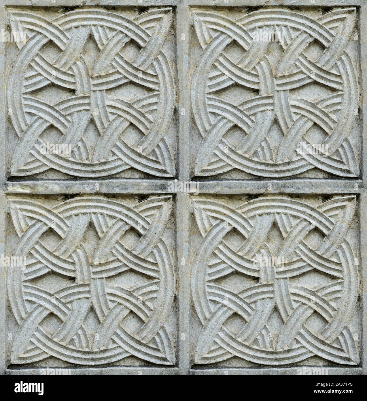 Christian pattern carved in stone on the wall of an old Christian ...