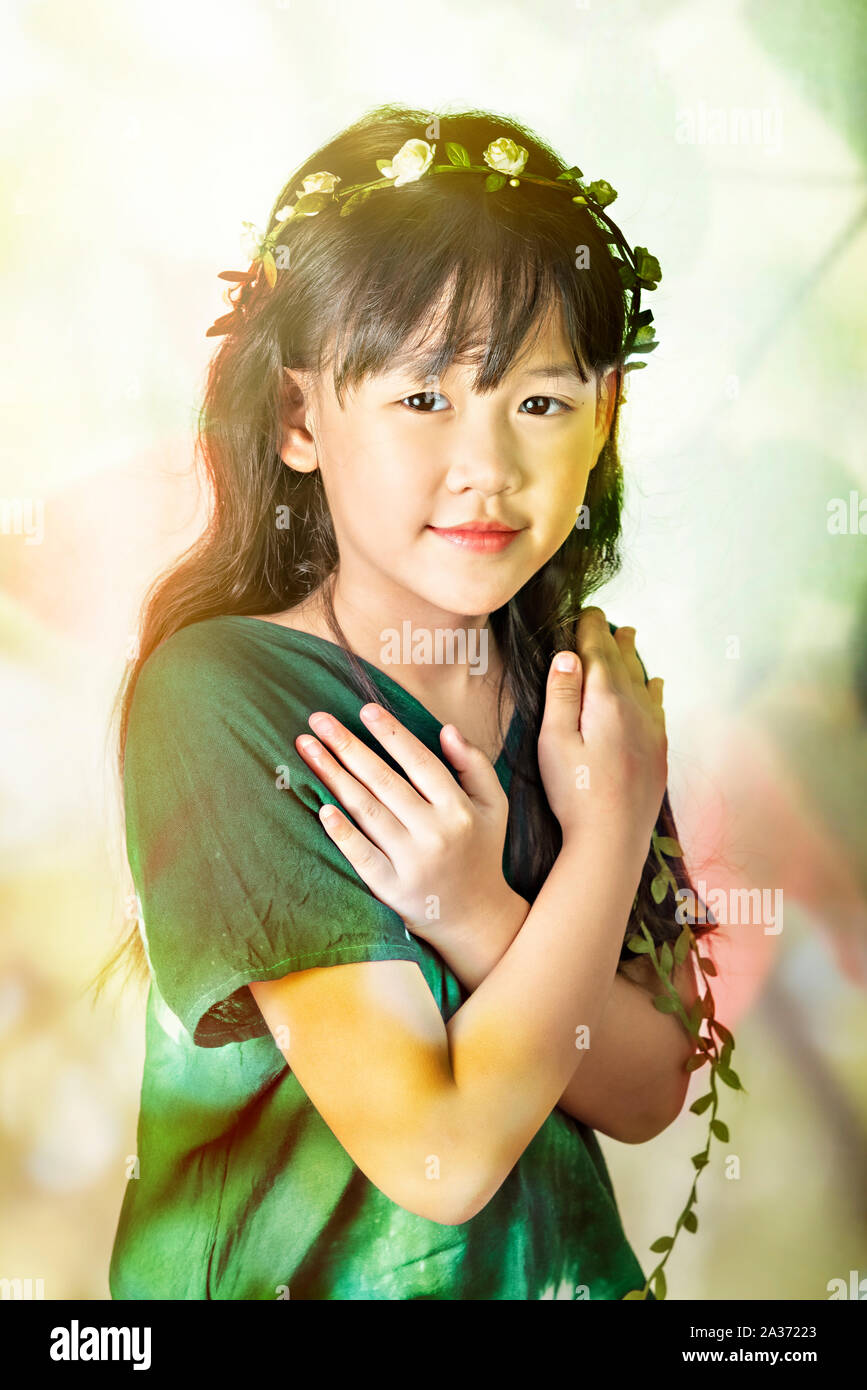 Cute asian little girl with wreath of flowers on her head Stock Photo ...