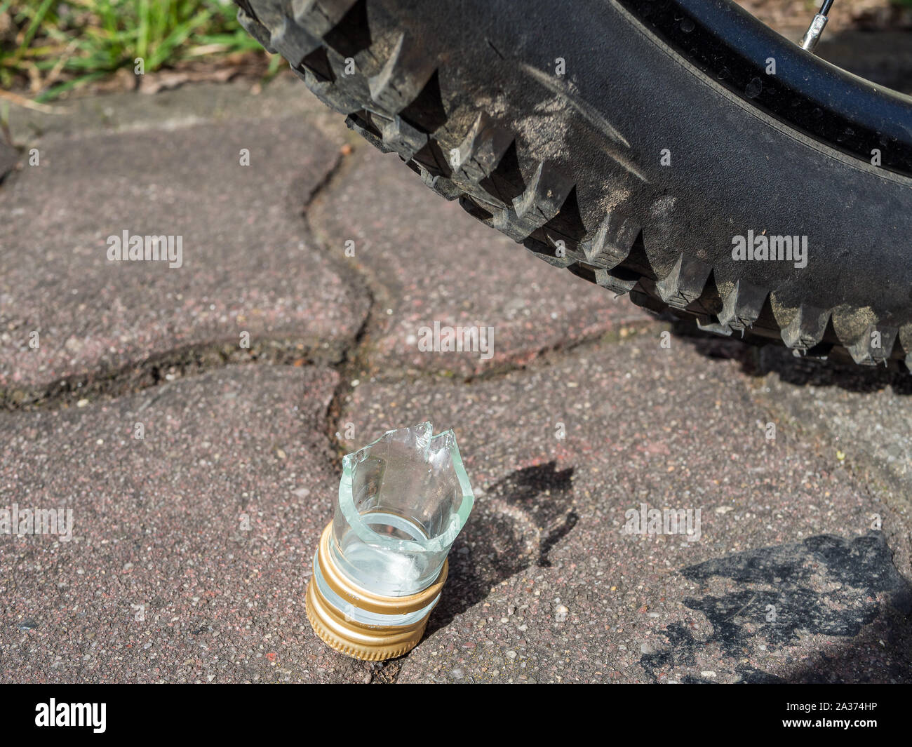 Bicycle tire plates through glass Stock Photo - Alamy