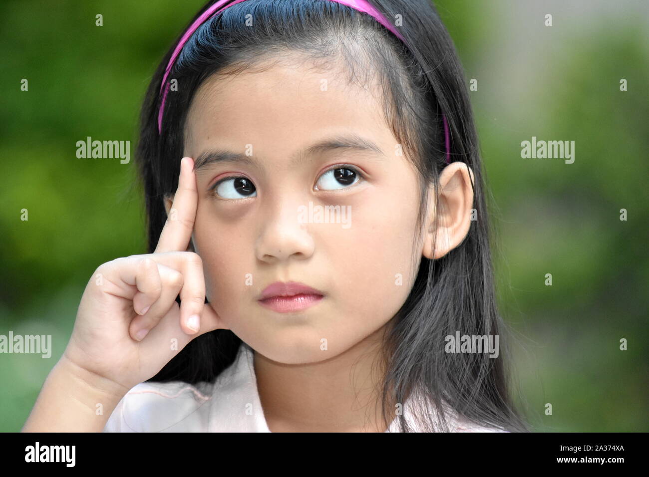 Filipino kid thinking hi-res stock photography and images - Alamy