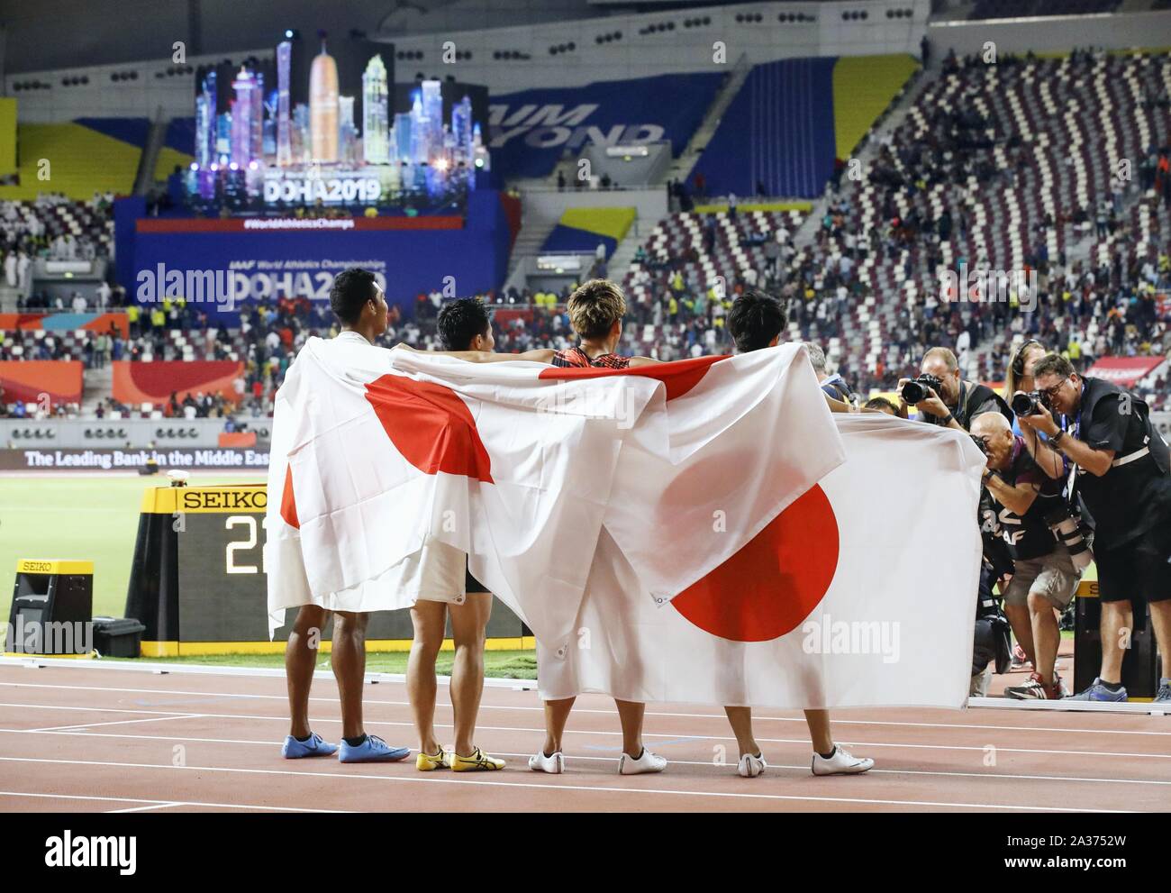 The Japanese men's 4x100-meter relay team poses for a photo after ...