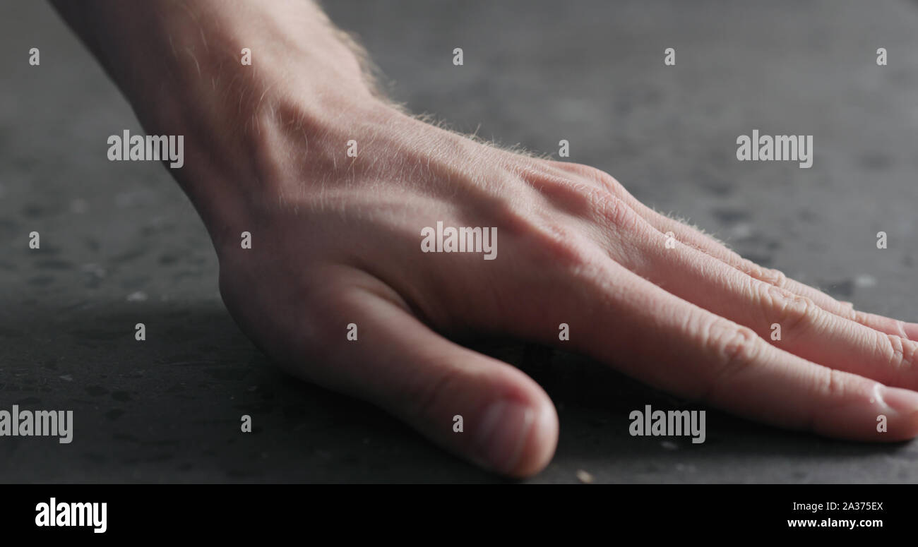 man hand crush walnut on terrazzo countertop, wide photo Stock Photo ...