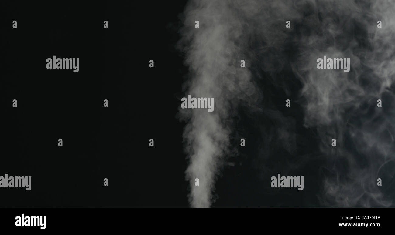 water mist stream over black background, wide photo Stock Photo - Alamy