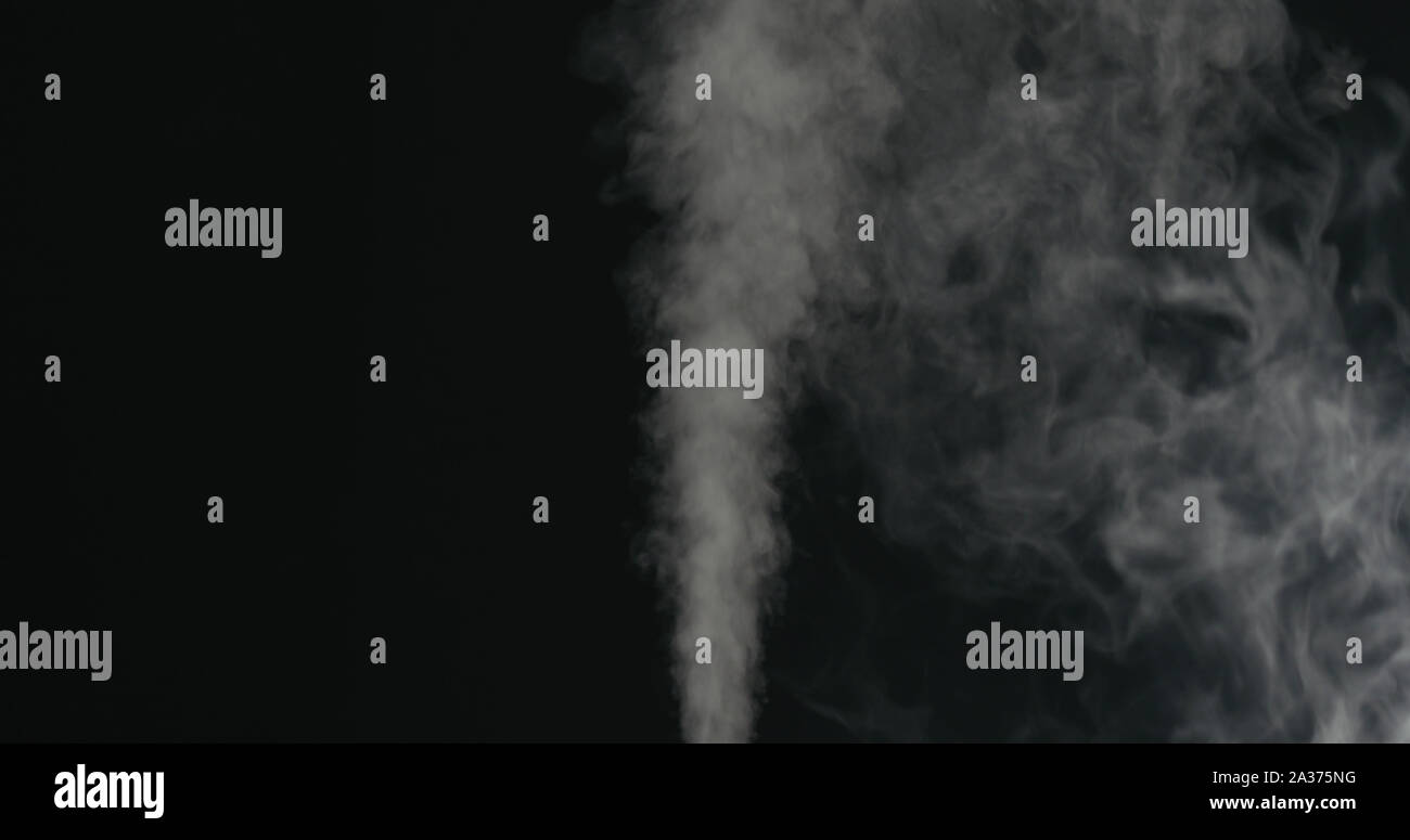 water mist stream over black background, wide photo Stock Photo - Alamy