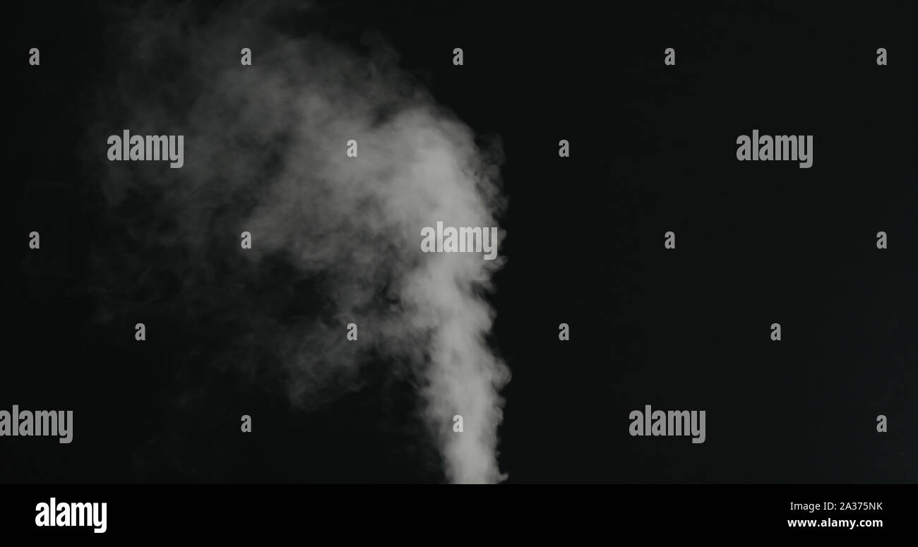 water mist stream over black background, wide photo Stock Photo - Alamy