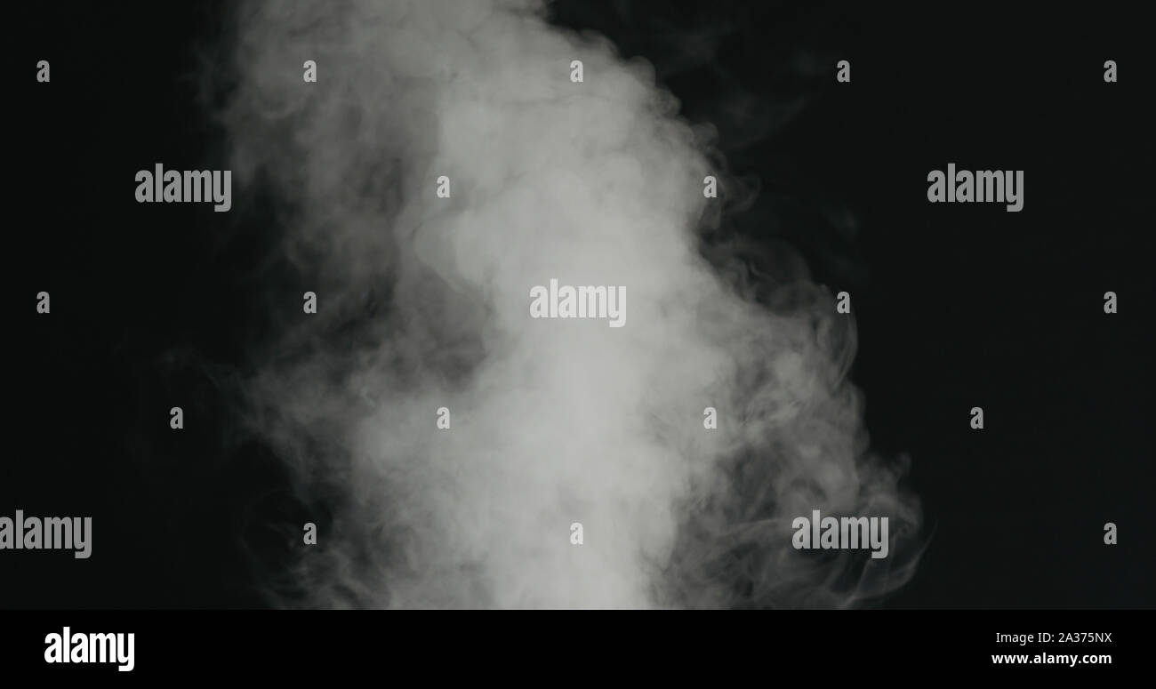 water mist stream over black background, wide photo Stock Photo - Alamy