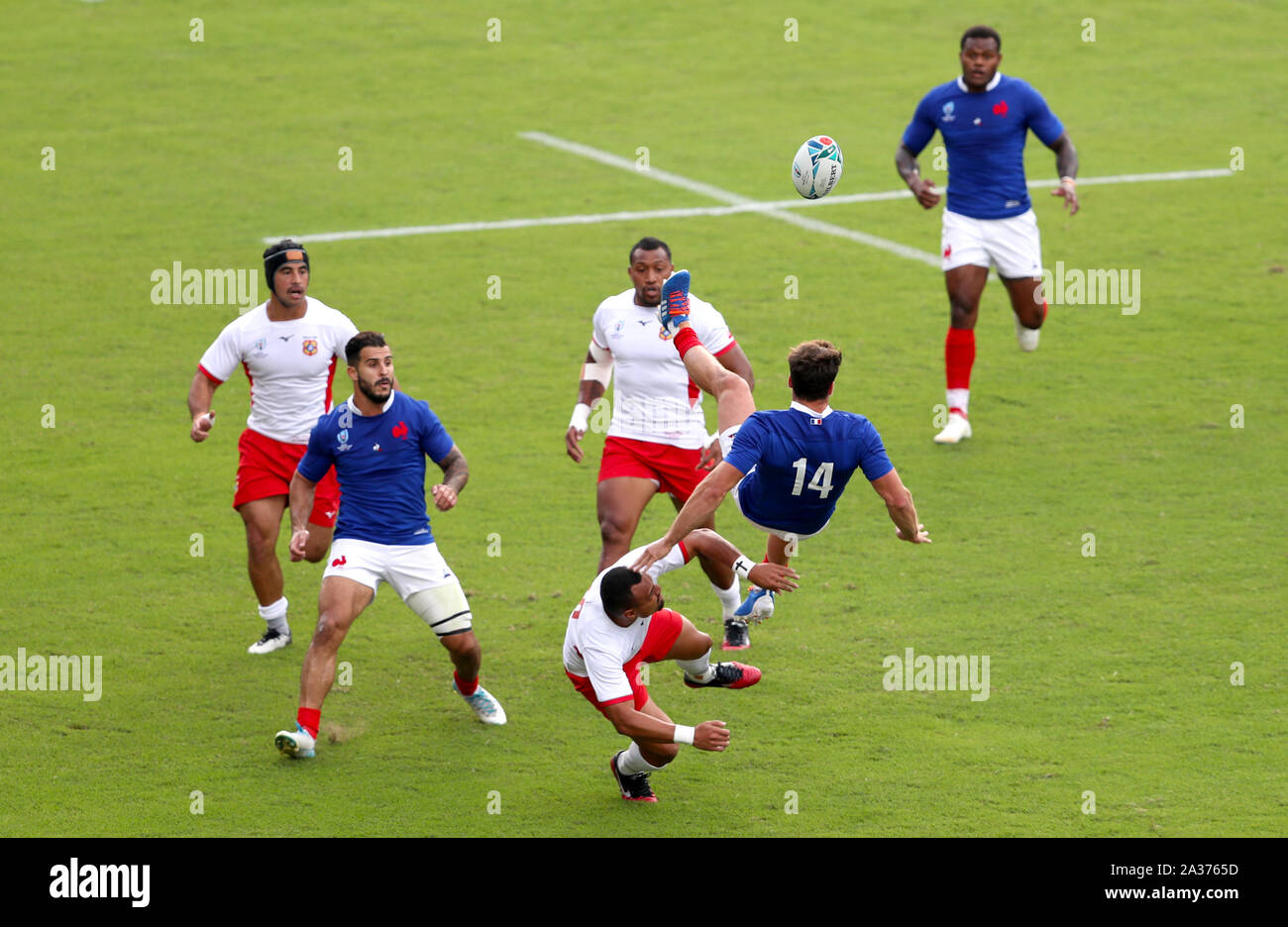 Tonga's James Faiva (left) and France's Damian Penaud in action during ...