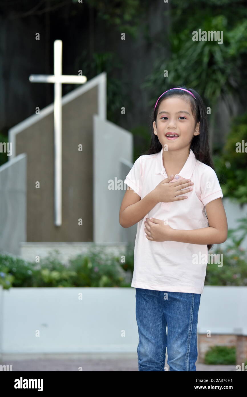 Cute girl with cross hi-res stock photography and images - Alamy