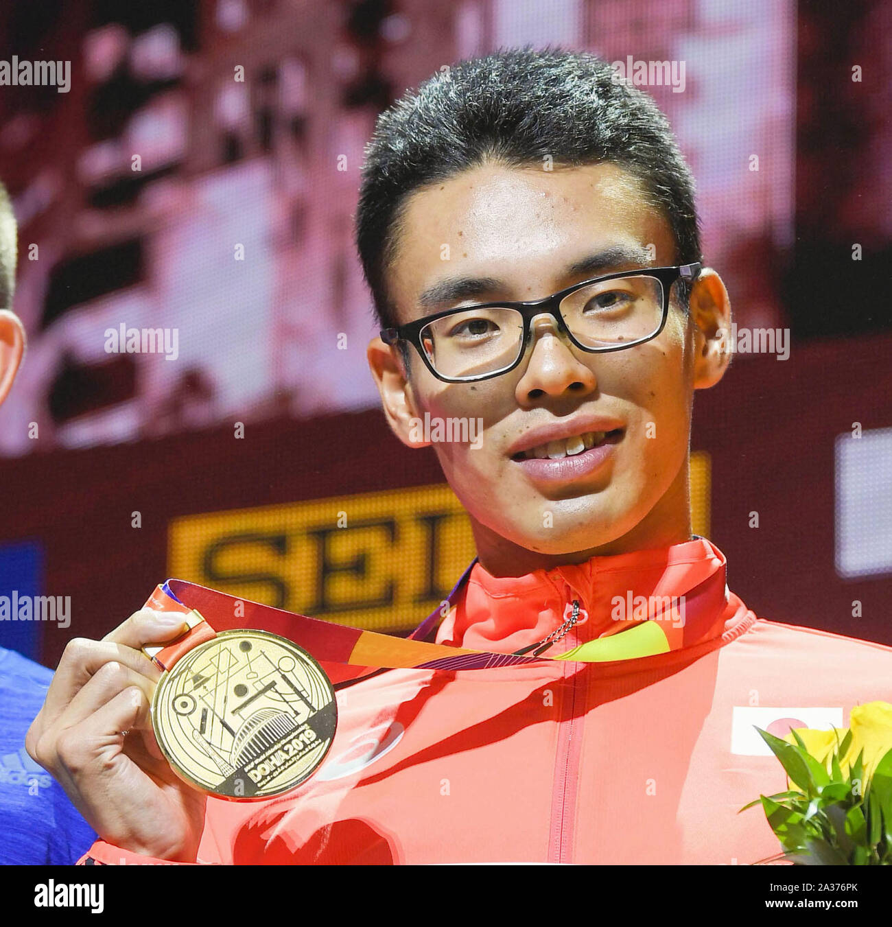 Japan's Toshikazu Yamanishi poses with his gold medal during the award ...