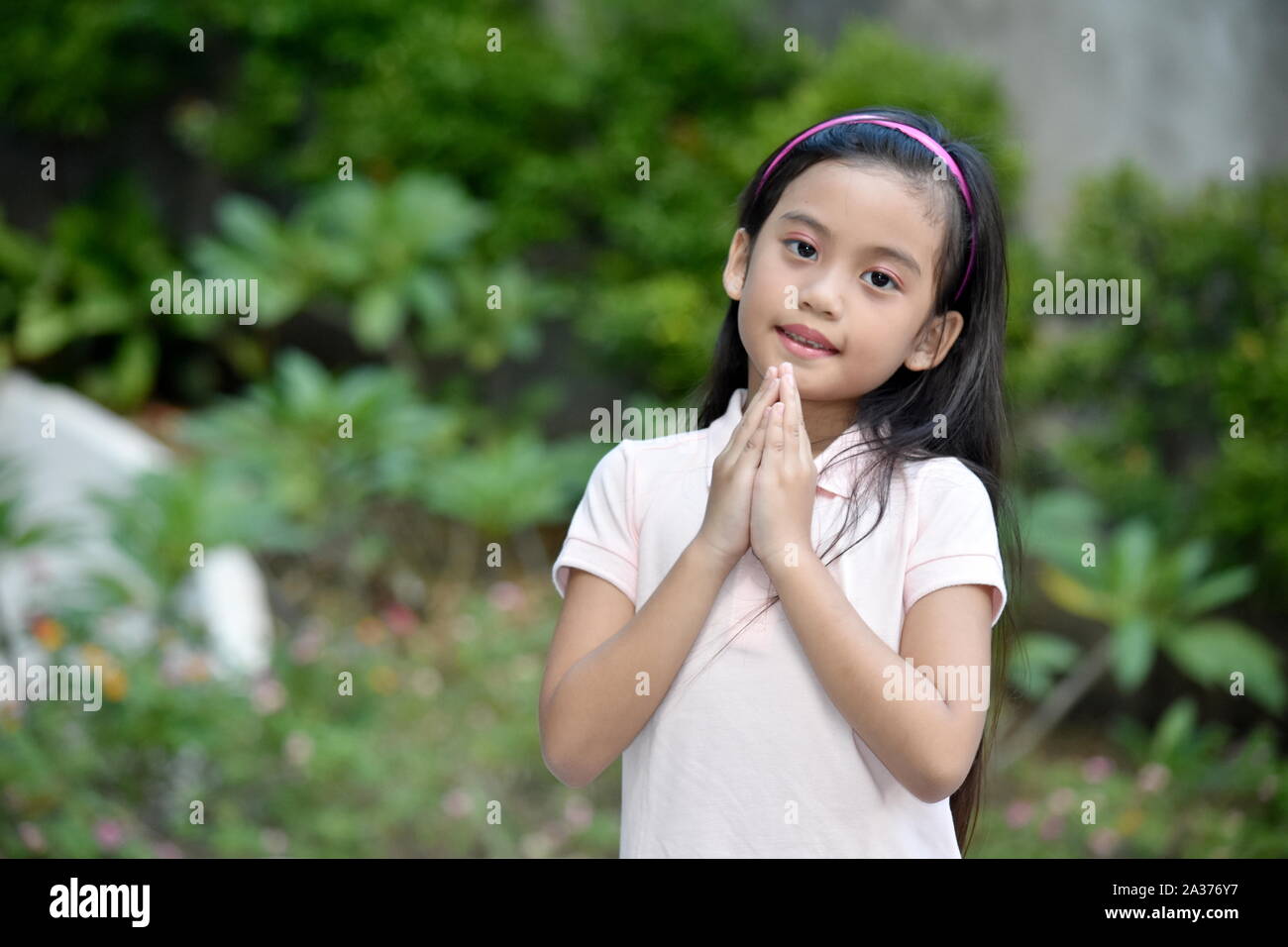 An A Diverse Female Praying Stock Photo - Alamy