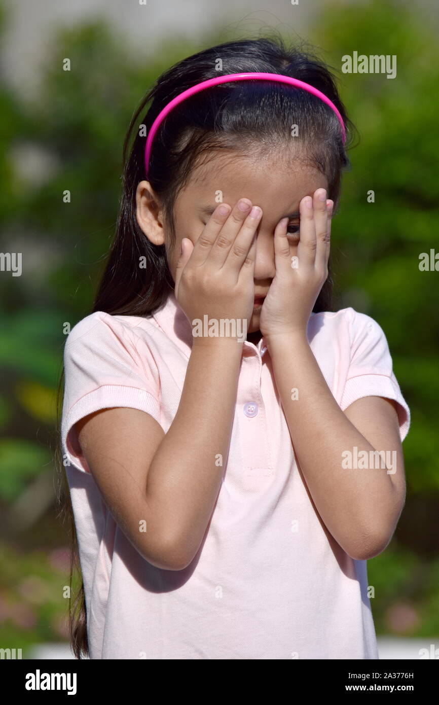 A Petite Filipina Girl And Sadness Stock Photo - Alamy
