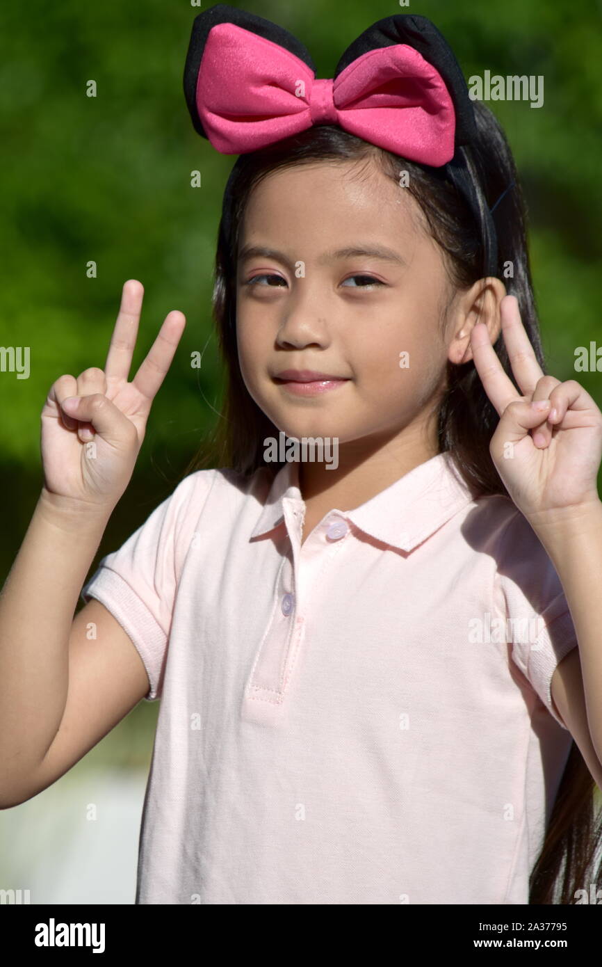 A Female And Peace Sign Stock Photo - Alamy