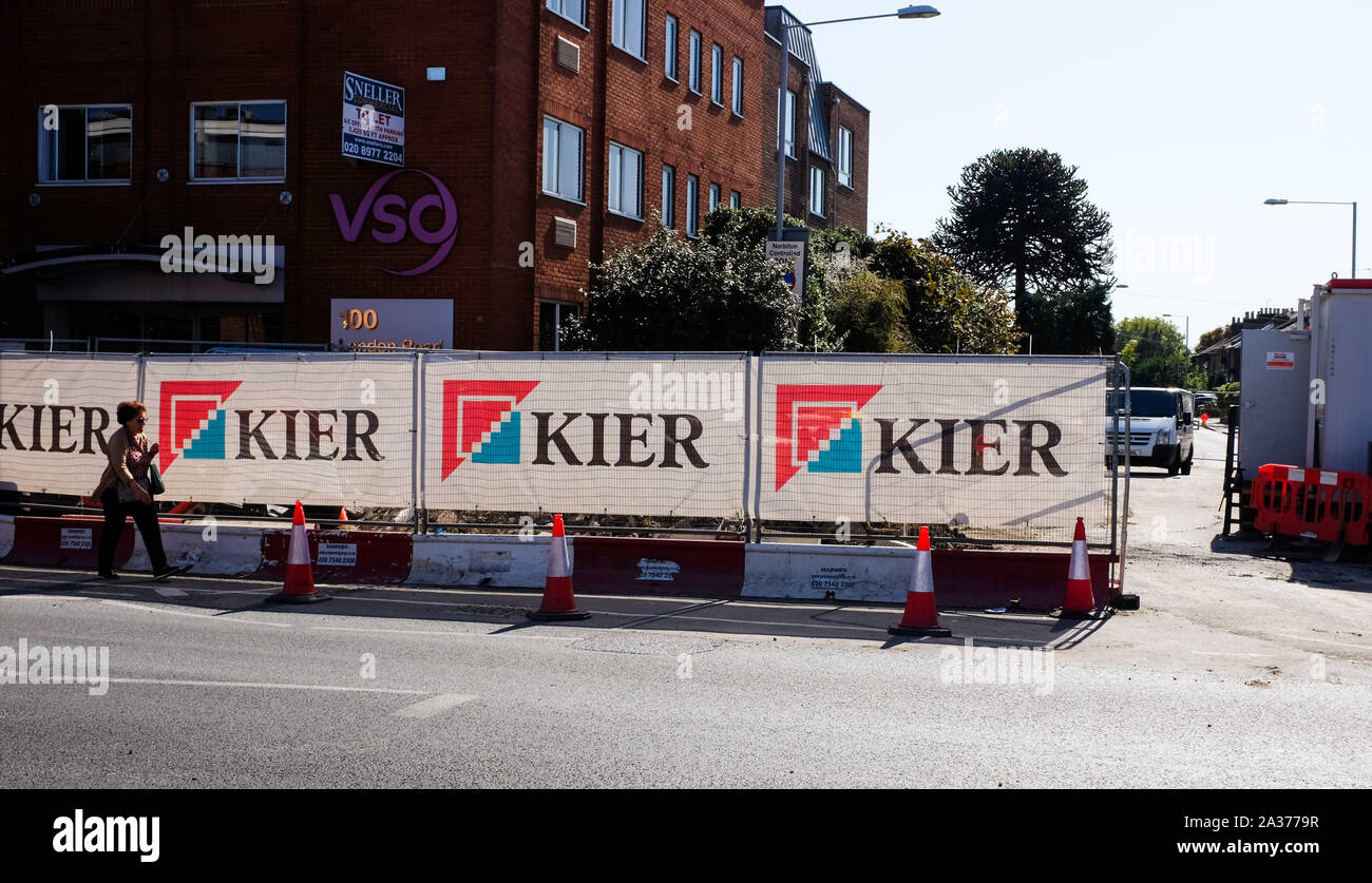 Kingston Upon Thames South West London UK - Woman walks past a Kier ...