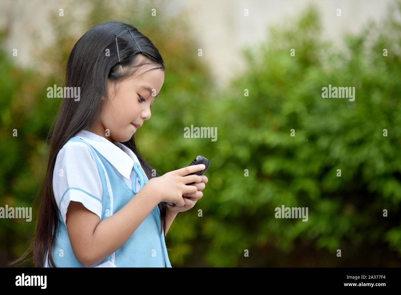 Girl uniform phone hi-res stock photography and images - Alamy
