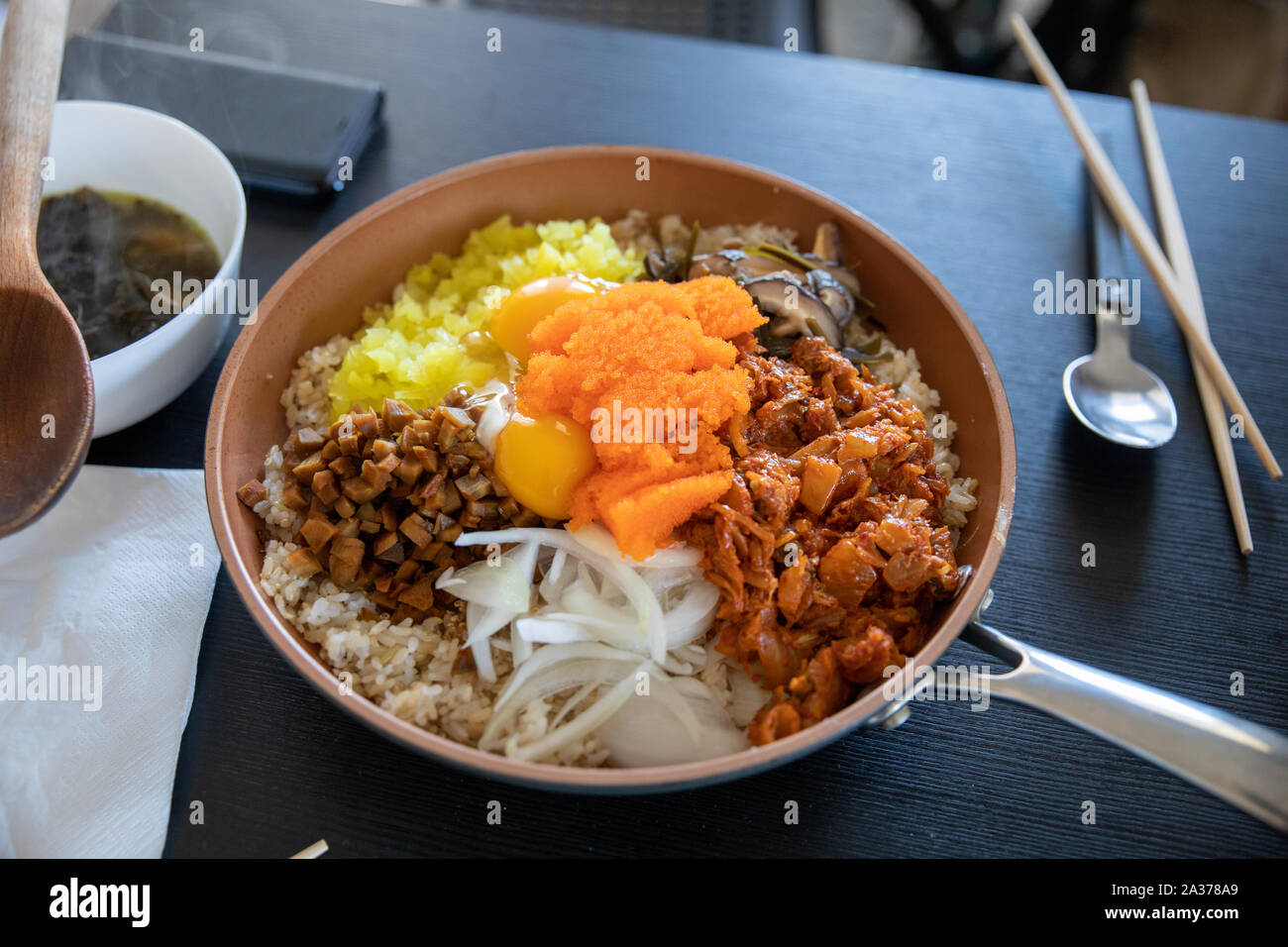 Albap- Korean rice with Tobiko egg, is orange (flying fish roe) on ...