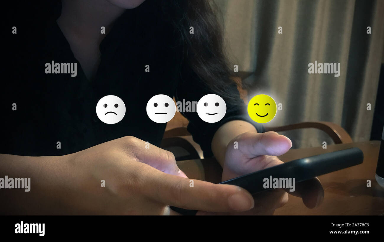 Customer experience concept. A woman using smartphone choose happy ...