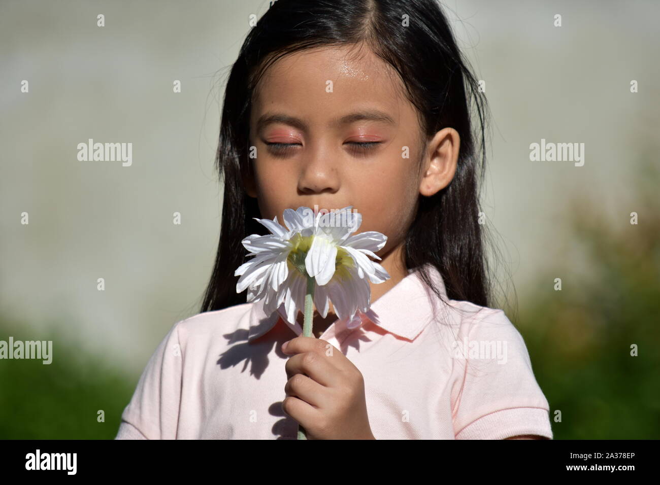An Adorable Cute Female With Flowers Stock Photo - Alamy