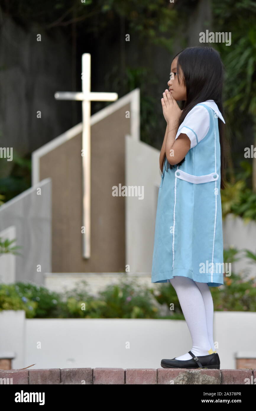 Religious Asian Tween In Prayer At Church Stock Photo - Alamy