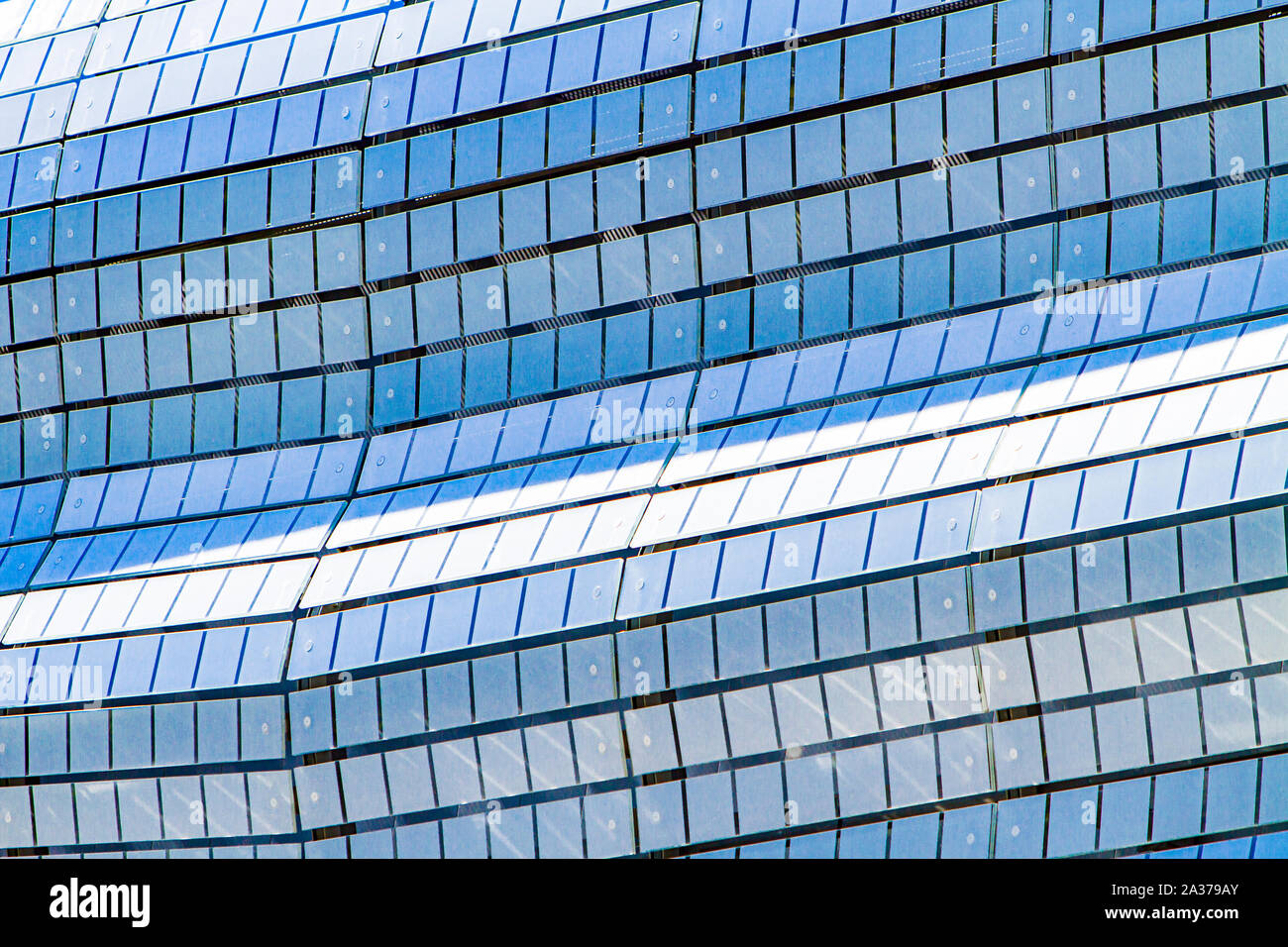 Wavy glass front of a modern office building Stock Photo - Alamy