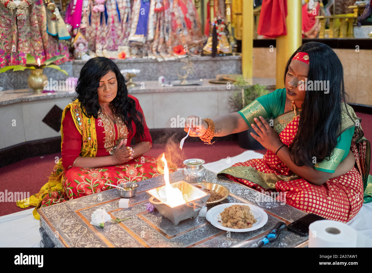 At the beginning of services for Navarati, A Hindu priestess (green ...