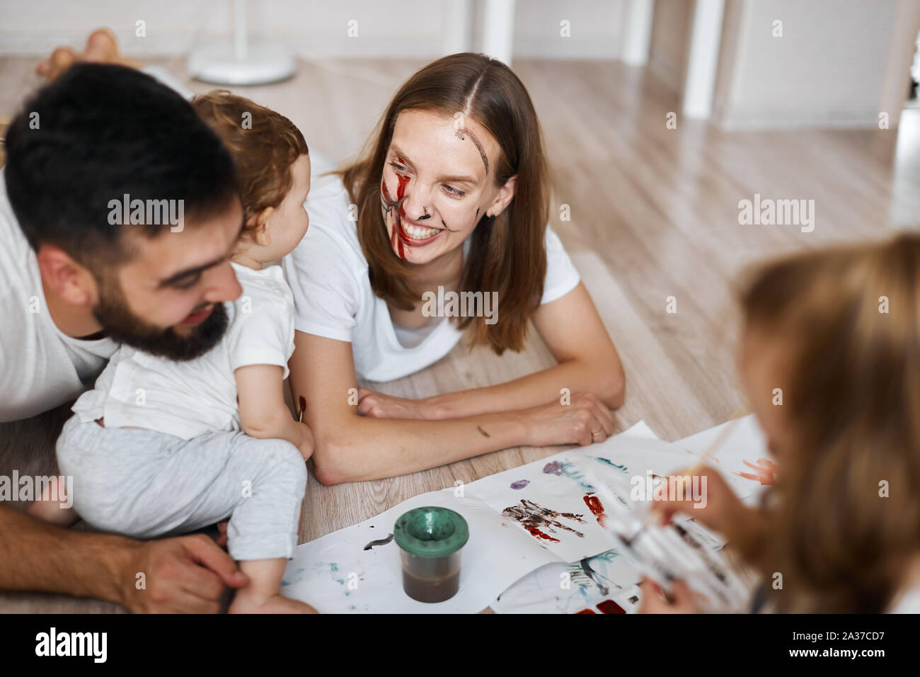 little girl is talking with her mother while having art class, close up ...