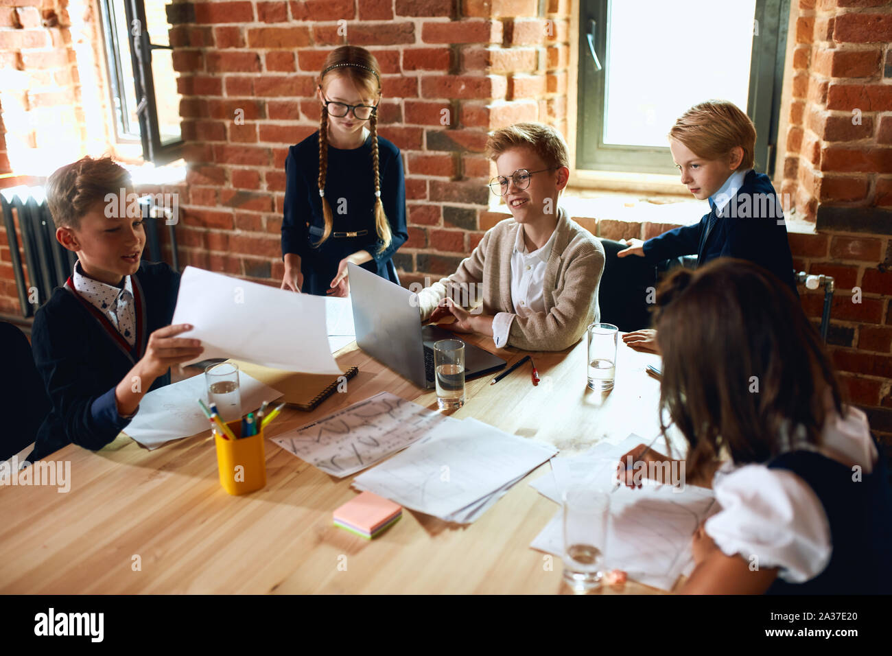 Cute children working together as a team, close up photo. partenrship ...