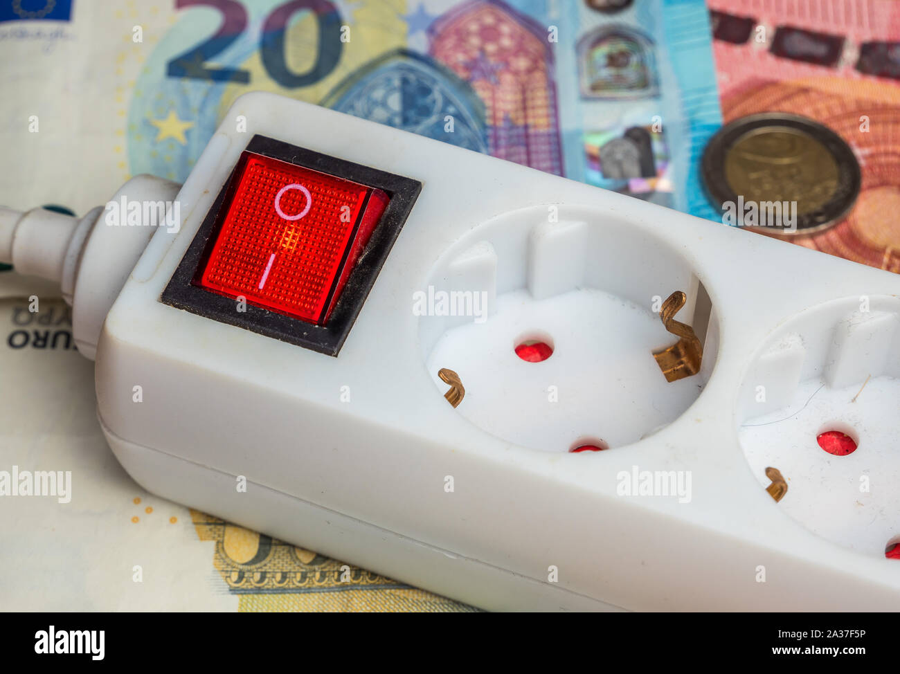 Money, outlet and rising energy costs Stock Photo - Alamy