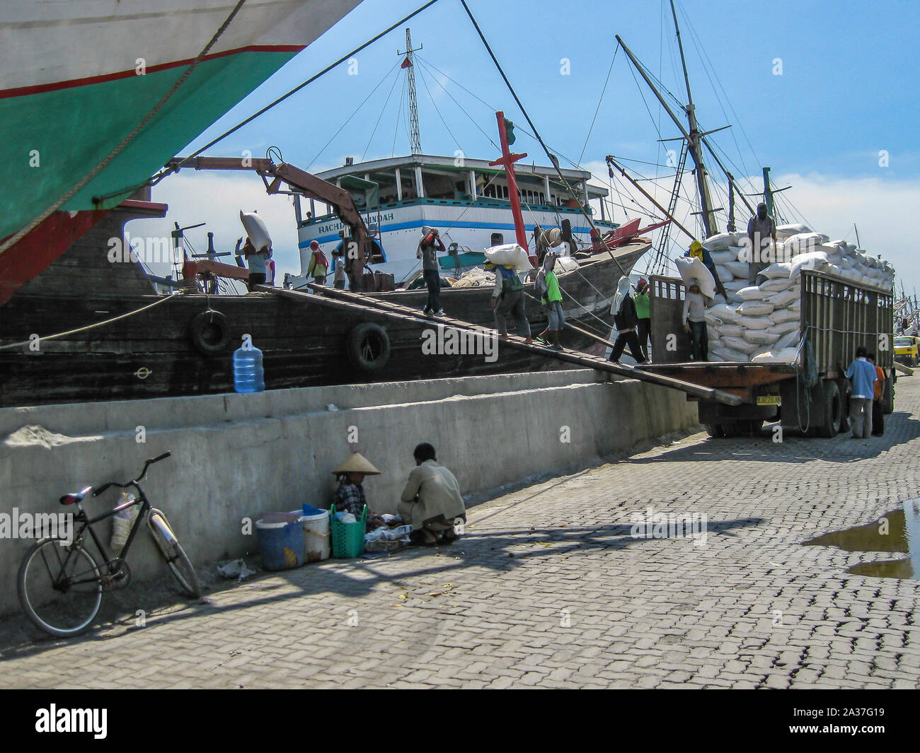 Jakarta, Indonesia - July 13, 2009: unskilled workers loading sacks ...