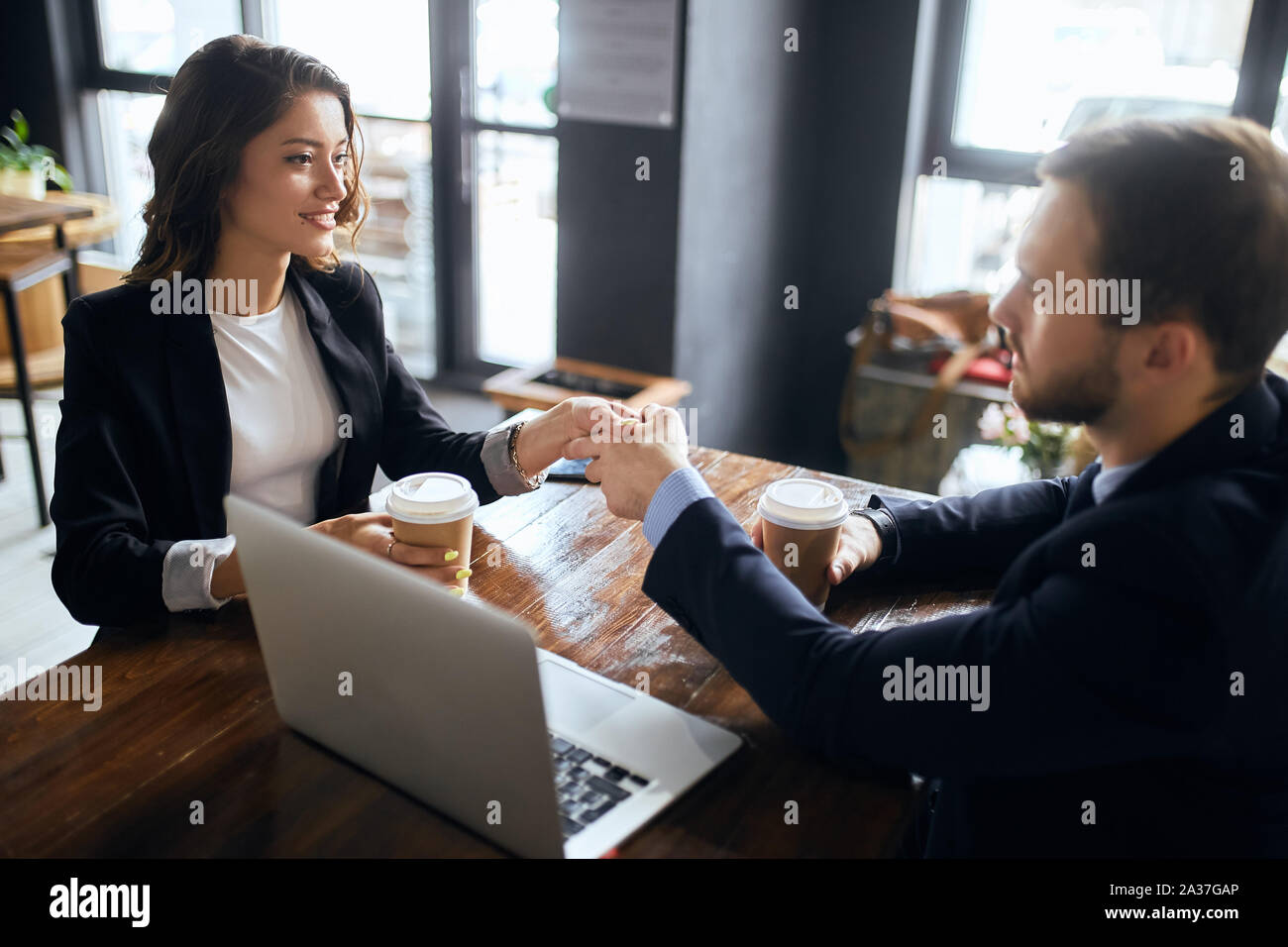 nice to meet young . two attractive partners greeting each other in the ...