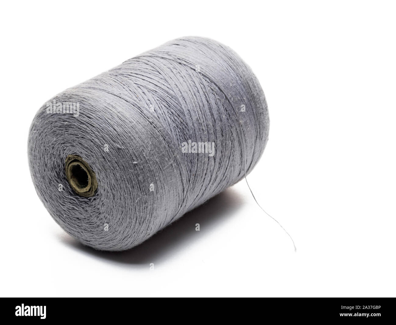 Big spool of gray threads on a white background Stock Photo - Alamy