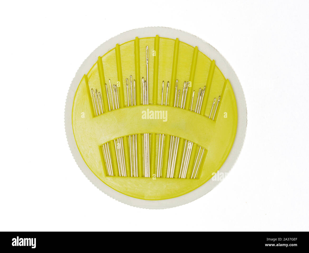 Set of needles in yellow box on a white background Stock Photo - Alamy