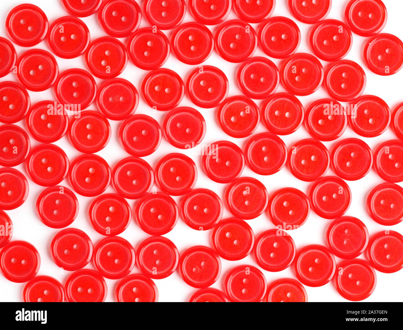 Red plastic buttons on white background Stock Photo - Alamy