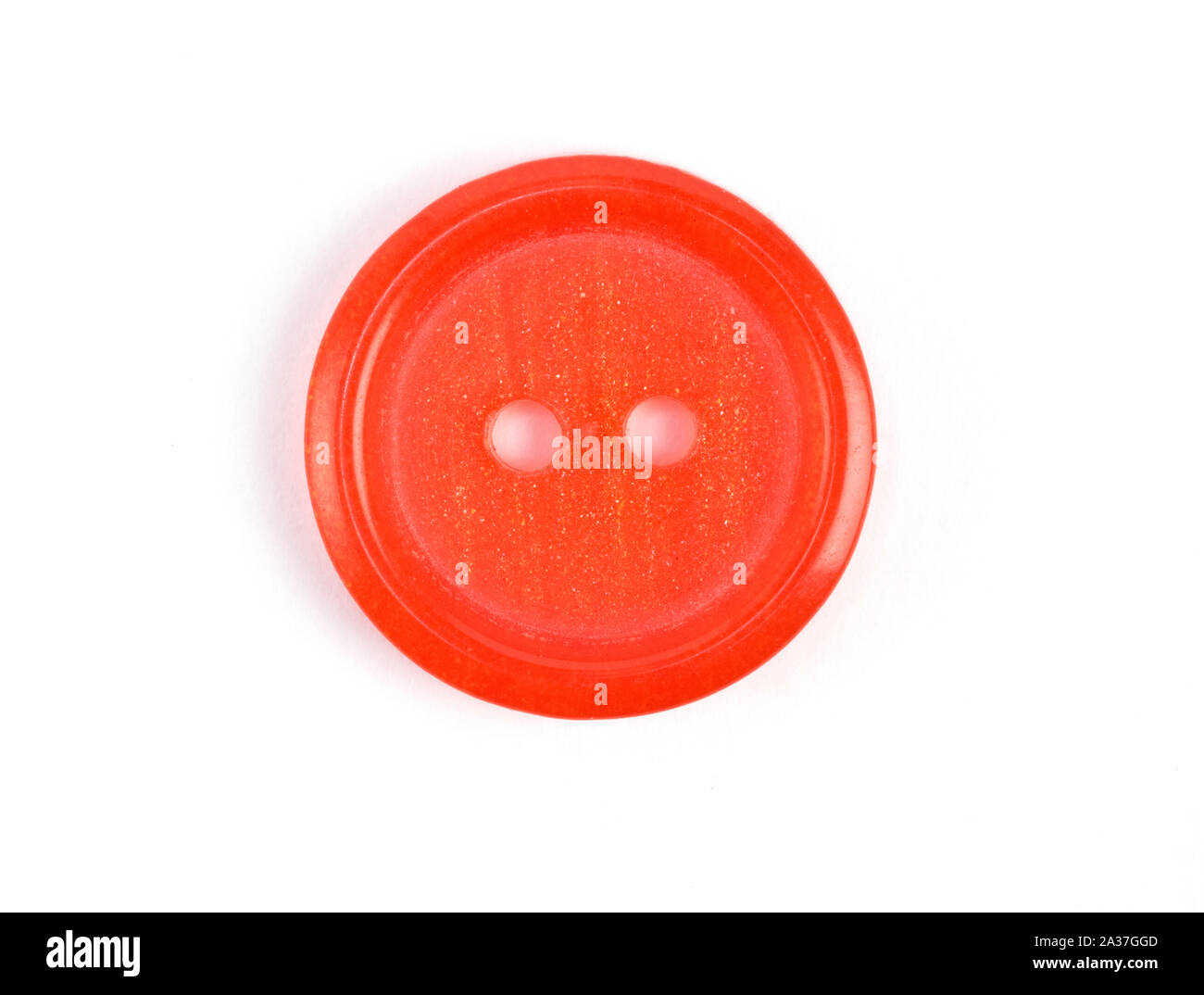 Red plastic button on white background Stock Photo - Alamy