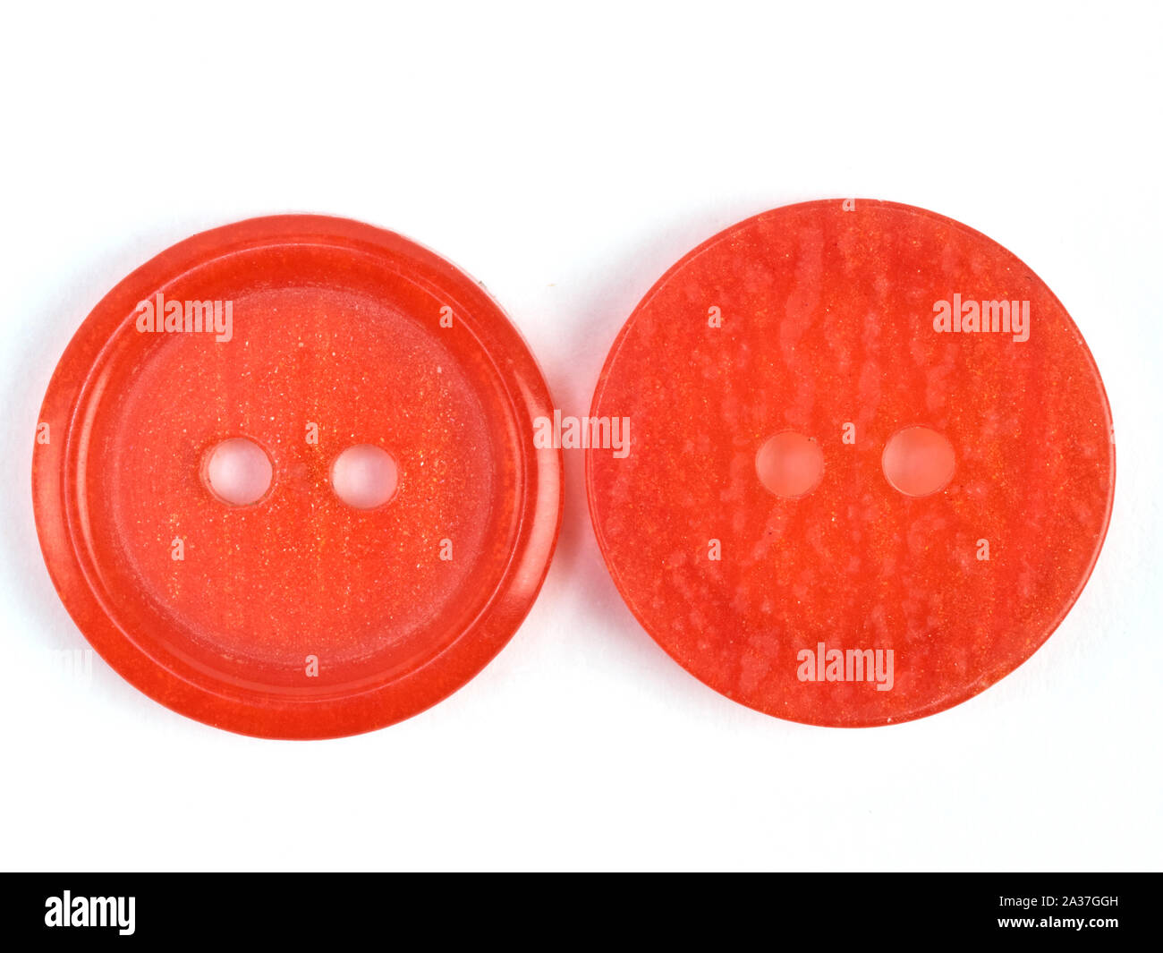 Red plastic button from two side on white background Stock Photo - Alamy