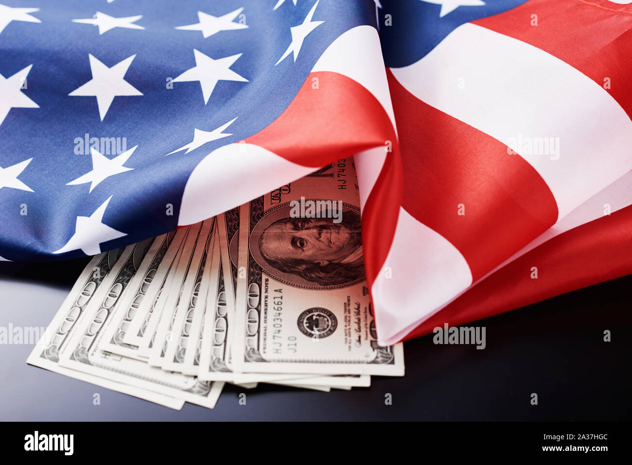 USA national flag and currency usd money banknotes on dark background ...