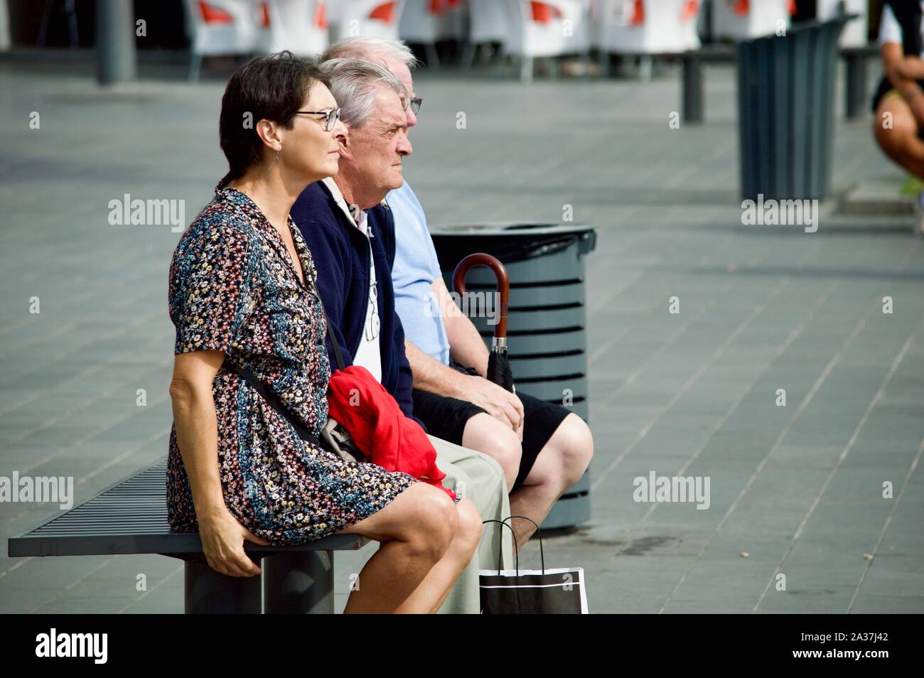 People sat down on a bench in Cap d'Agde, France Stock Photo - Alamy
